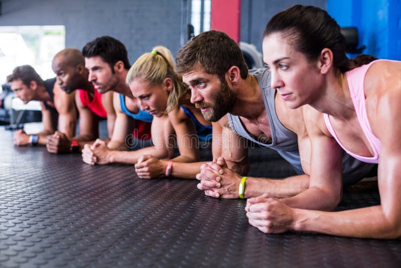 Serious Friends Exercising in Gym Stock Photo - Image of mature ...