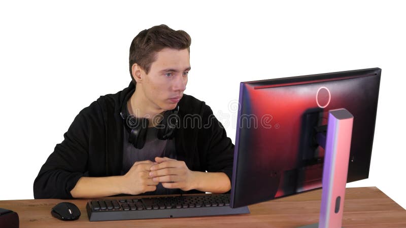 Serious Gamer Sitting at Computer Watching a Game on Gradient Ba Stock ...