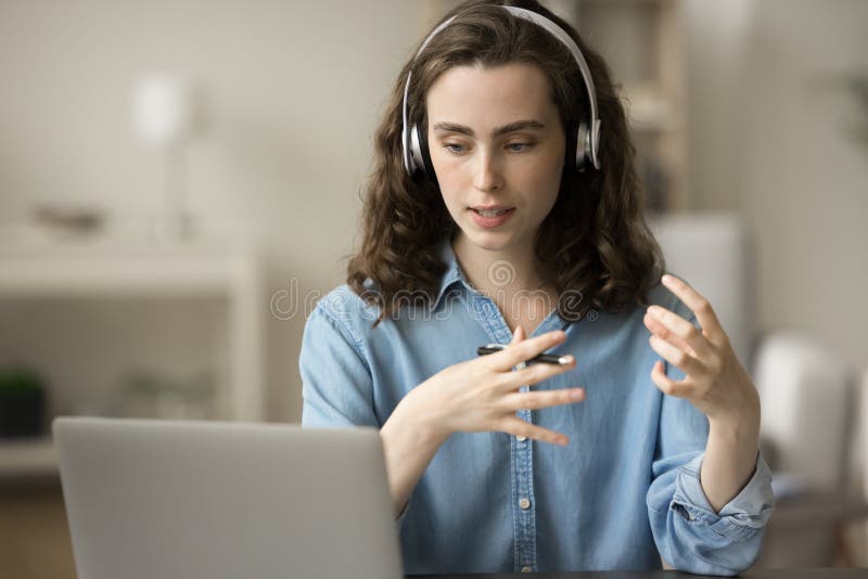 Serious Gen Z Student in Headphones Talking on Video Call Stock Photo ...
