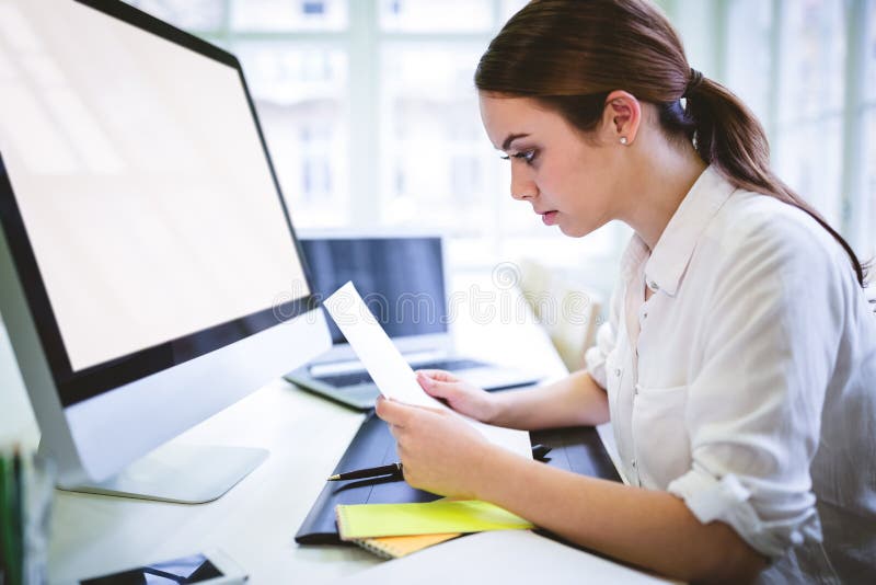 Serious Graphic Designer Looking at Document Stock Image - Image of ...