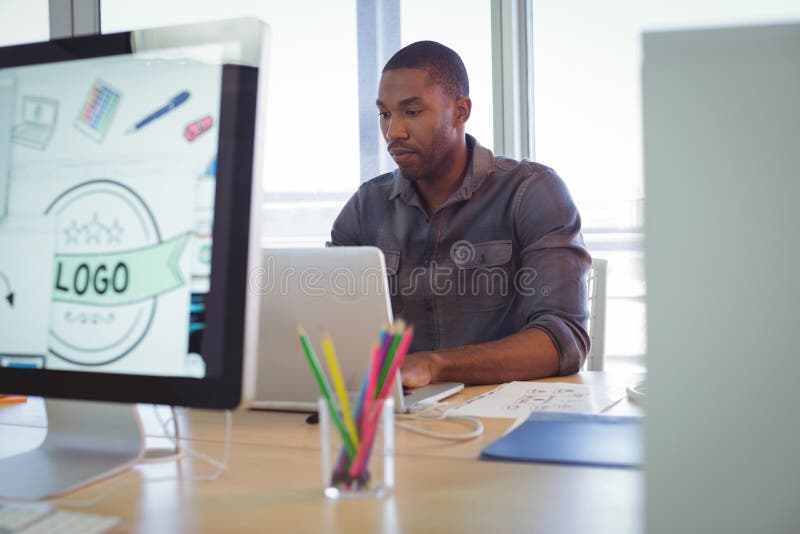 Serious Graphic Designer Using Laptop in Creative Office Stock Image ...