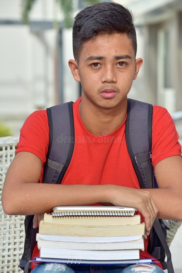 Serious Handsome Minority Boy Student with Notebooks Stock Photo ...