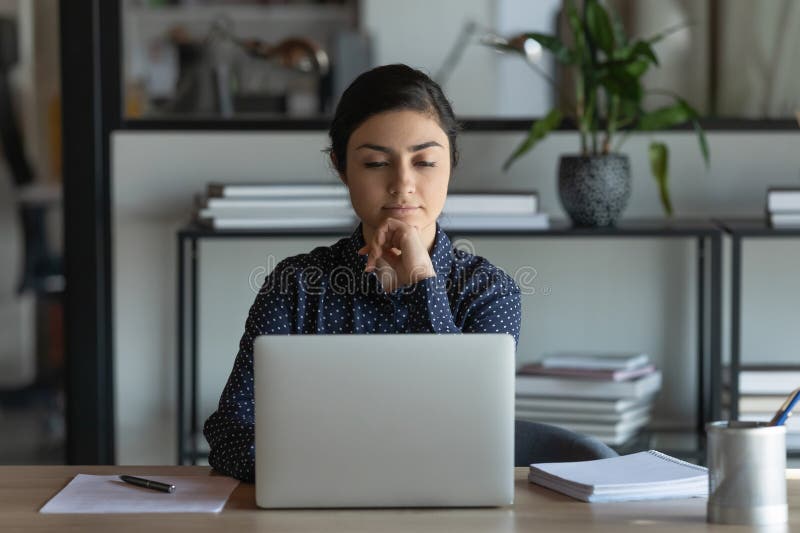 Serious Indian Female Student Using Laptop for Studying, Learning ...