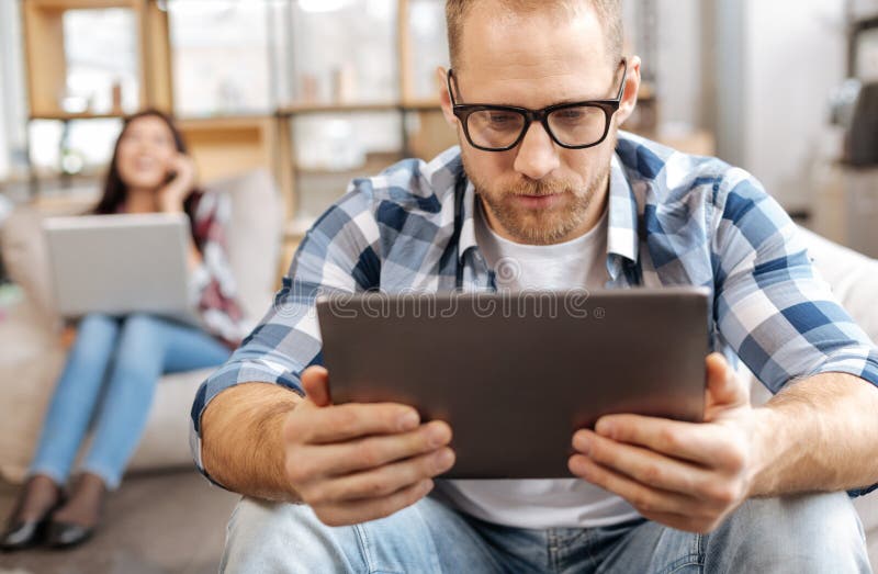 Serious Intelligent Man Looking at the Tablet Screen Stock Image ...