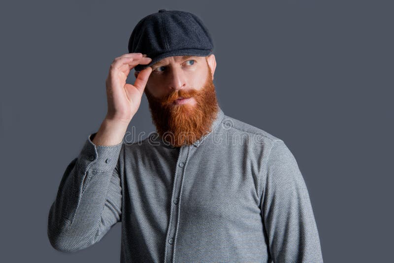 Serious Irish Guy Adjusting Cap. Portrait of Bearded Guy Stock Image ...