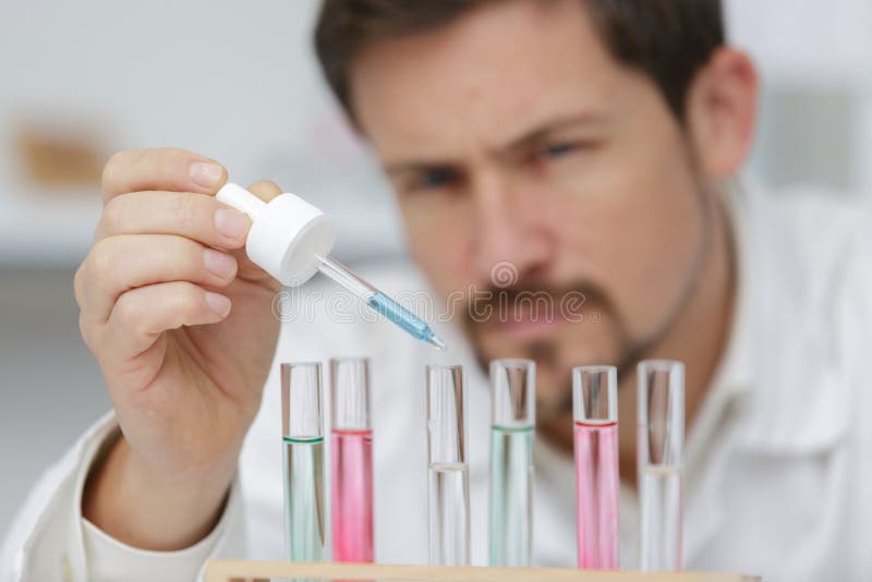 Serious Lab Technician at Work Stock Image - Image of vials, examining ...