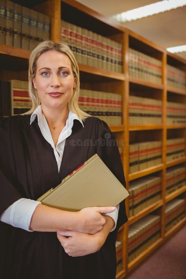 Serious Lawyer Holding a File while Standing Stock Photo - Image of ...