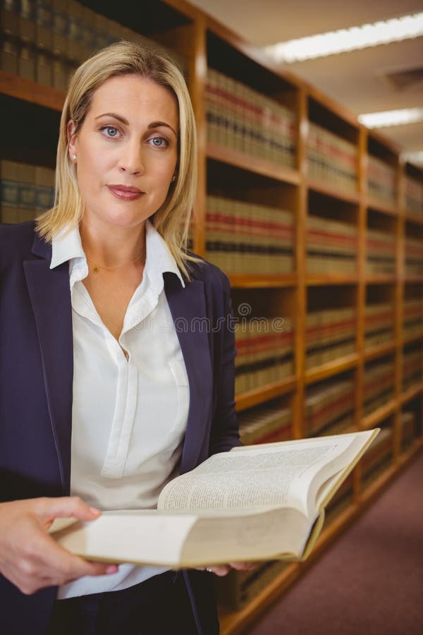 Female Librarian Posing and Holding a Book Stock Photo - Image of ...