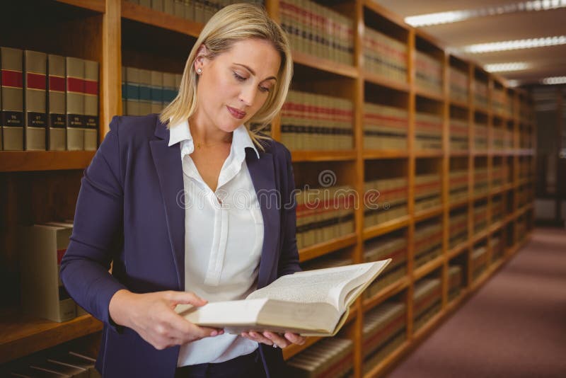 Serious Librarian Reading a Book Stock Photo - Image of library, side ...