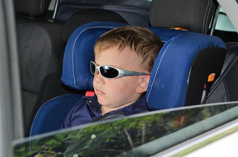 Serious little boy in car stock image. Image of friendly - 31847101