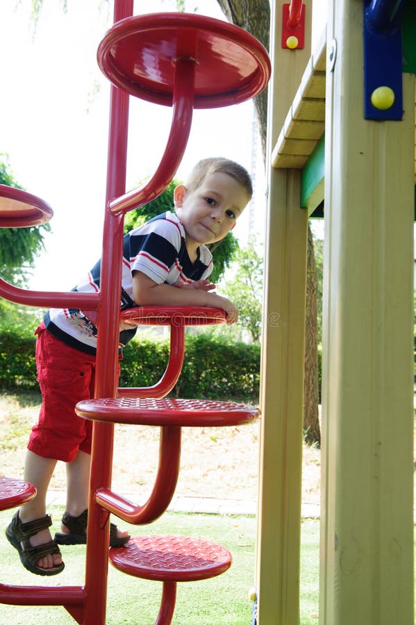 Serious Little Boy Sitting at Playground Stock Photo - Image of despair ...