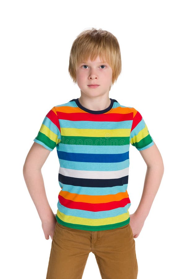 Serious little boy stands stock photo. Image of studio - 78407058