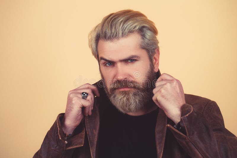 Serious Looking Dramatic Man in Jacket, Standing on Gray Studio ...