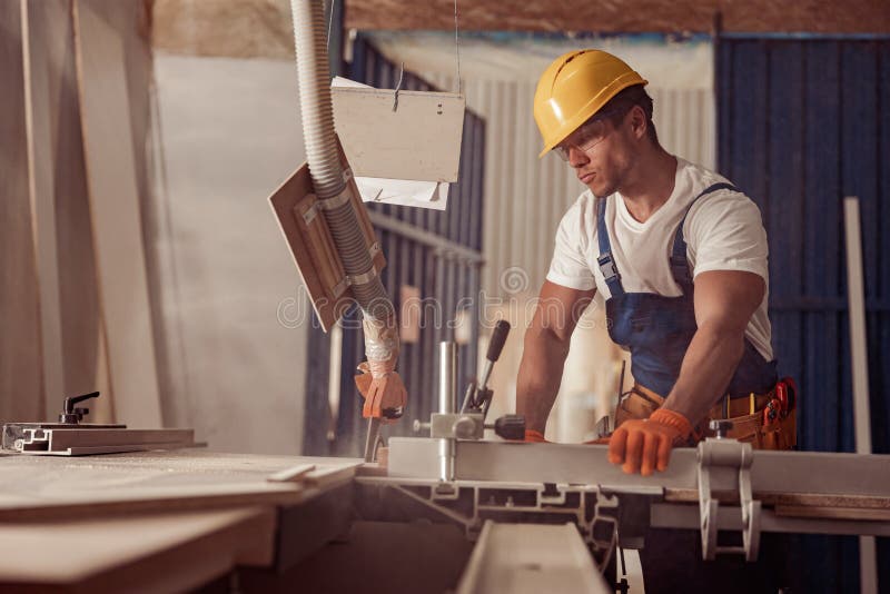 Serious Male Builder Using Woodworking Machine in Workshop Stock Image ...