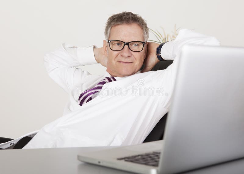Serious Male Clinician Viewing Something at Laptop Stock Image - Image ...