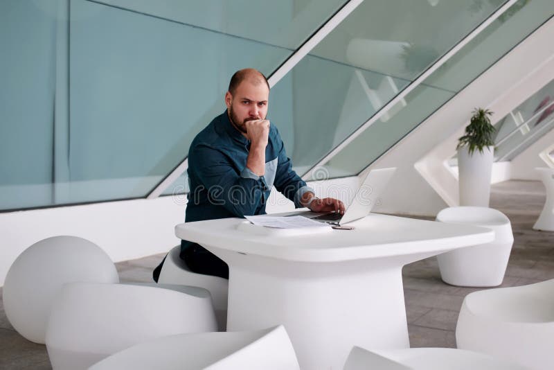 Serious Male Developer Thinking about Ideas for Creating New Website on ...