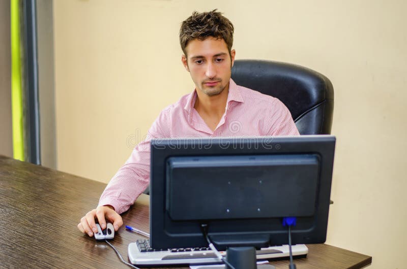 Serious Male Office Worker at Desk Working Stock Image - Image of ...