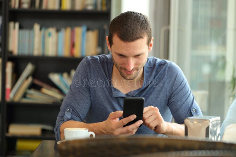 Serious Man Checking Phone Content in a Bar or Home Stock Image - Image ...