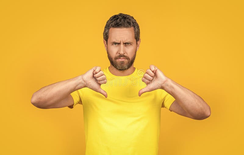 Serious Man with Dislike Gesture on Background. Man with Dislike ...