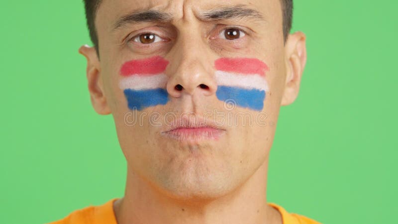 Serious Man with a Dutch Flag Painted on the Face Stock Footage - Video ...