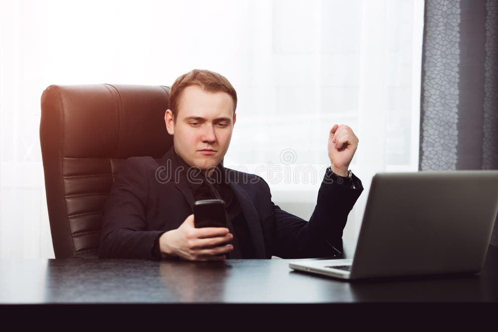 Serious Man in Formal Clother Browsin the Web with Phone Stock Image ...
