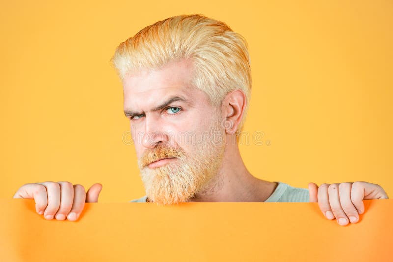 Serious Man Holding Blank Sheet. Red Head Man Holding a Banner. Man ...