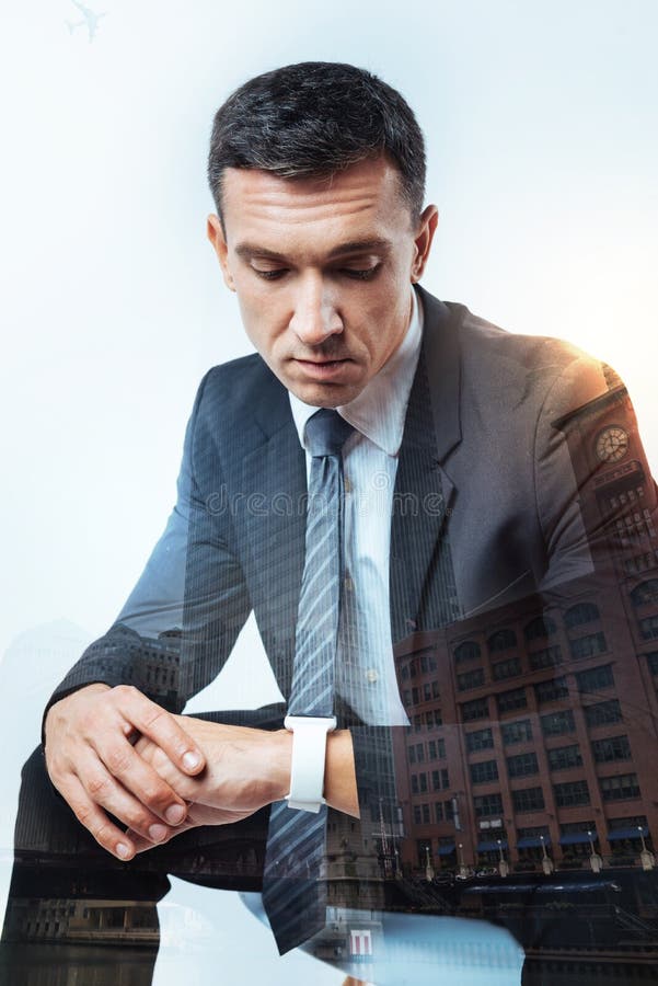 Serious Man Looking at His New Smart Watch Stock Image - Image of ...
