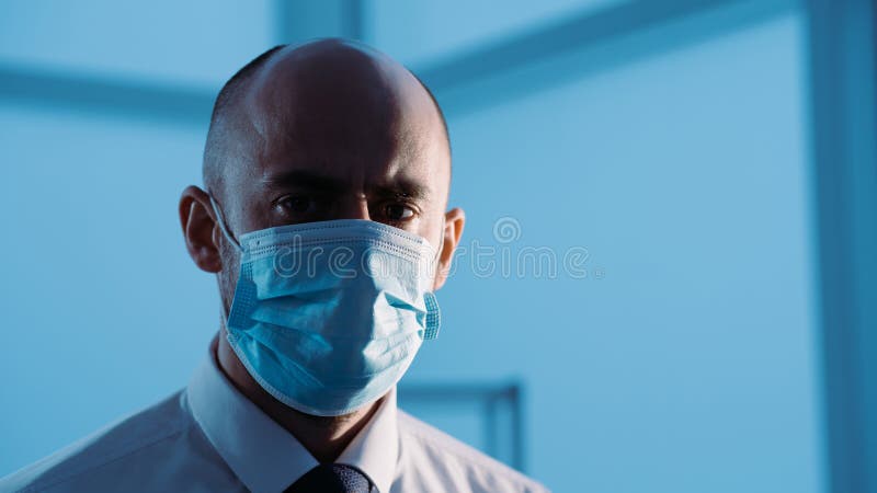 Serious Man in a Protective Mask Standing in the Medical Office . Stock ...