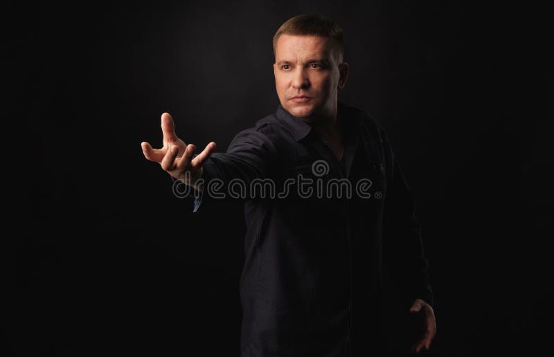 Serious Man with Raised Arm Stock Photo - Image of hand, space: 139930398