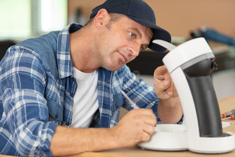 Serious Man Repairing Broken Coffee Machine Stock Photo - Image of neat ...