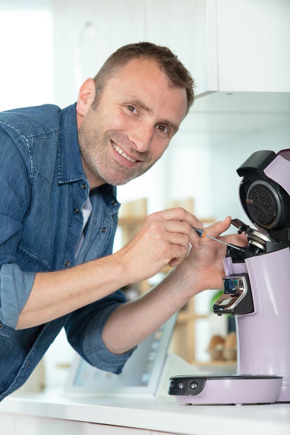 Serious Man Repairing Broken Coffee Machine Stock Photo - Image of ...