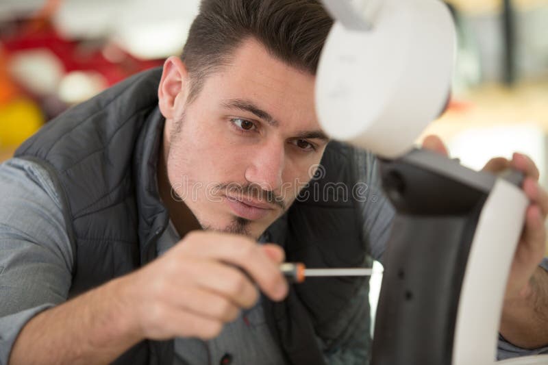 Serious Man Repairing Broken Coffee Machine Stock Photo - Image of ...