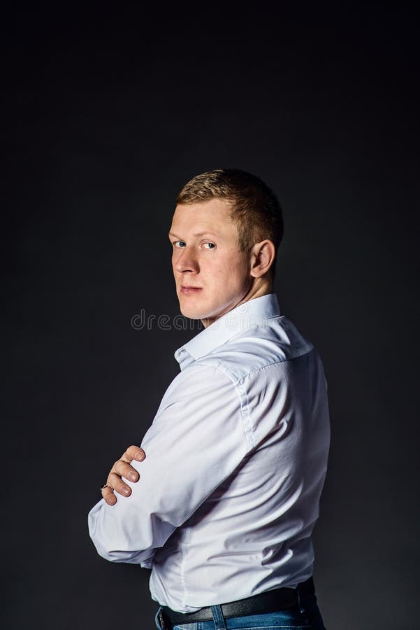 Serious Man Standing Sides in a Half-turn with Folded Hands. Studio ...