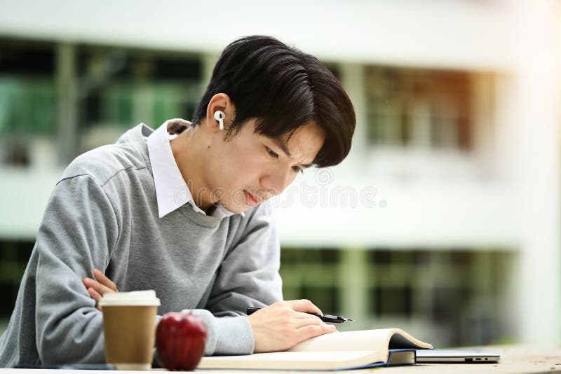 Serious Man Student Reading Textbook, Preparing for Exam or Doing ...