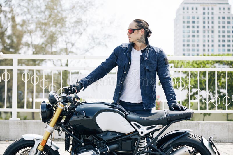 Serious Man Standing at Motorcycle Stock Photo - Image of mixedrace ...