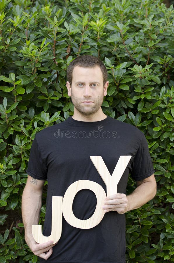 Serious Man with the Word Joy. Stock Photo - Image of spelled, young ...