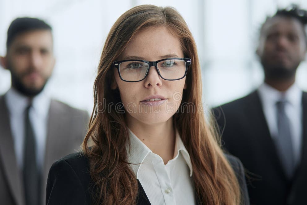 Serious Manager Posing in Front of His Two Employees Stock Photo ...