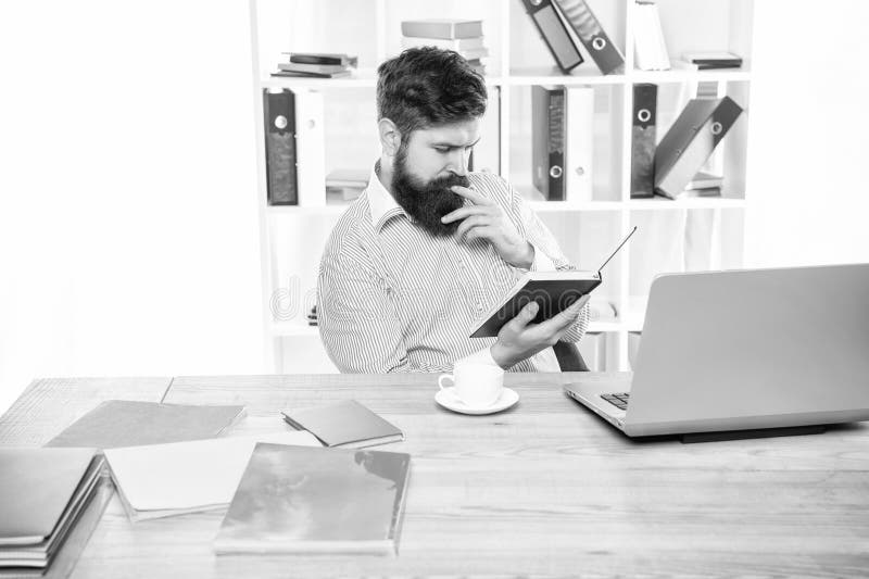 Serious Manager Reading Book Sitting at Office Desk Stock Image - Image ...