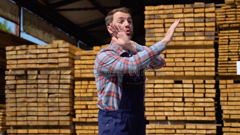 Serious Manager in Helmet and Uniform Giving Commands To Crane Operator ...