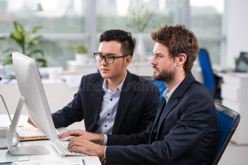 Serious managers stock photo. Image of technology, together - 63532228