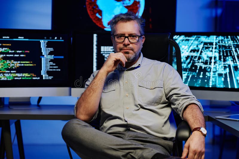Serious Mature Male Software Developer Sitting Against Computer Monitors Stock Image Image Of