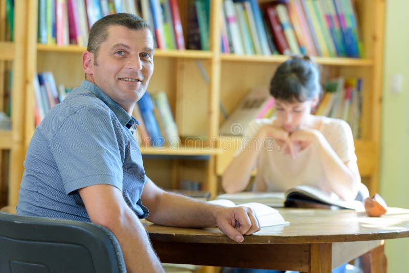 Serious Man Working in Library Stock Image - Image of buying ...