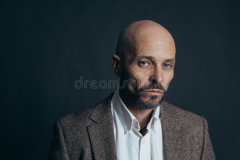 Serious Middle-aged Man with a Smile Dressed in Casual Poses on a Dark ...