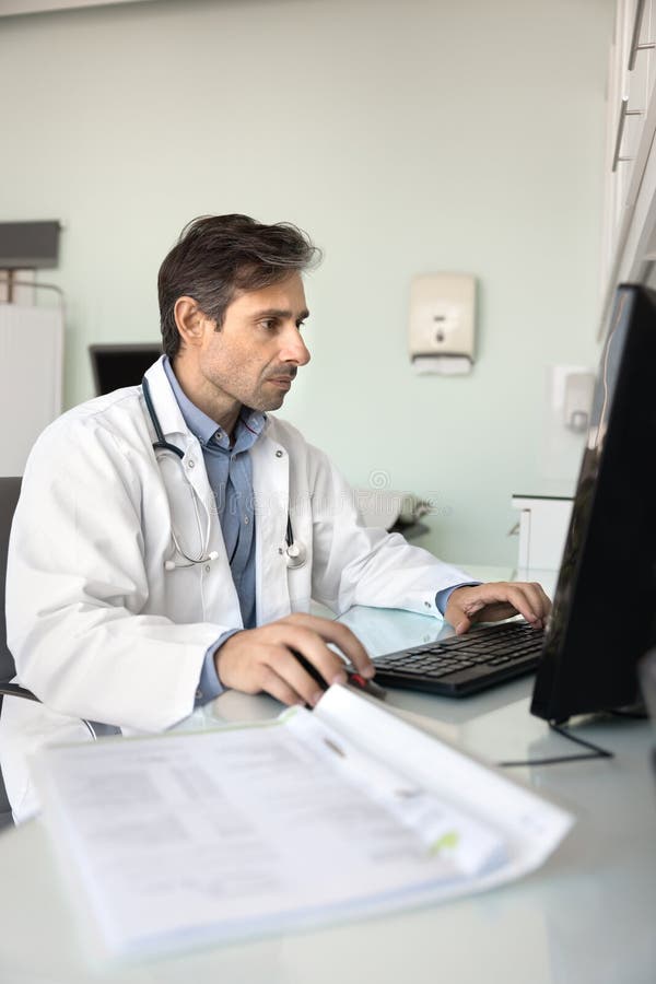 Serious Middle Aged Physician Doctor Man Typing Keyboard Stock Photos ...