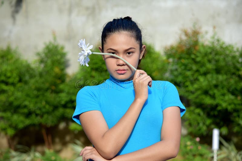 Serious Minority Person with a Daisy Stock Photo - Image of flower ...