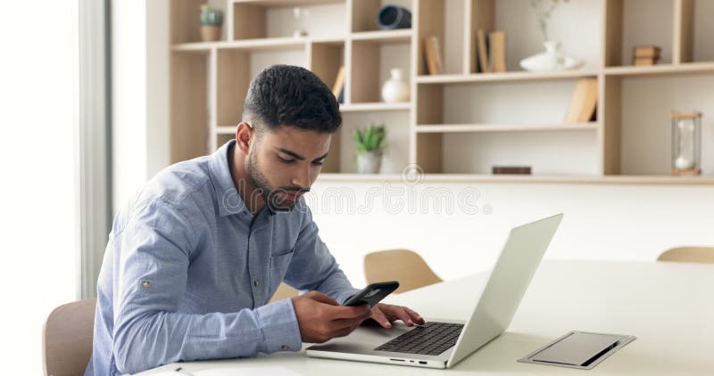 Serious Moroccan Office Employee Use Multiple Devices at Workplace ...