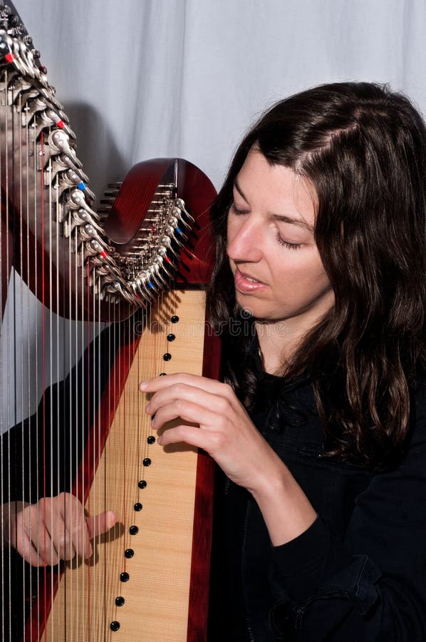 Serious Musician Plays Irish Harp Stock Photo - Image of musician ...