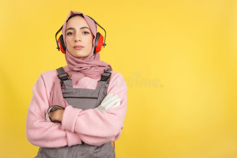 Serious Muslim Female Carpenter in Work Uniform Looking at Camera Stock ...