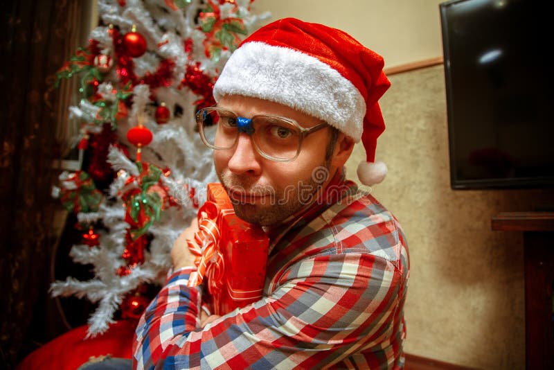 Serious Nerd in Santa Hat Gets a Christmas Gift Stock Photo - Image of ...
