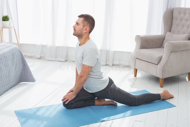 Serious Nice Man Doing a Physical Exercise Stock Photo - Image of ...
